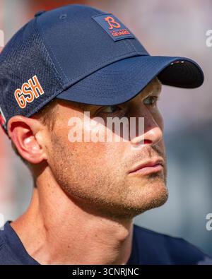 Chicago Bears head coach Ben Johnson, left, talks to an official during ...