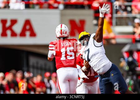Michigan defensive back TJ Metcalf, right, tackles Wisconsin running ...