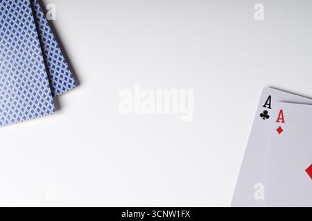Two aces with a deck of playing cards isolated on white background ...
