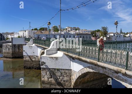 The seven-arched bridge over the Rio Gilao, in Tavira, old town, in the ...