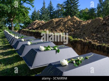 Lietzen, Germany. 23rd Sep, 2025. Small coffins containing the remains ...