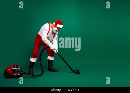 Festive backdrop of Christmas mascot costume Stock Photo - Alamy