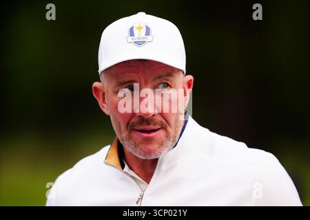 Tommy Fleetwood of Team Europe with caddie Ian Finnis during the Sunday ...