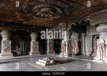Detail of intricate stone pillar carving at cave temple in Badami ...
