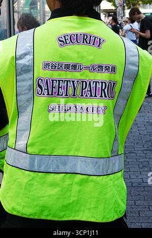Tokyo, Japan - August 31, 2025: Two Japanese security guards conduct an ...