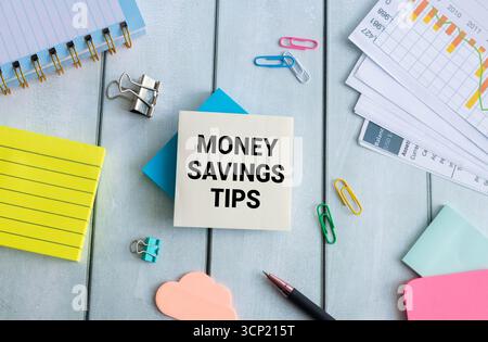 Money Saving Tips text messege and piggy bank on pink background Stock ...