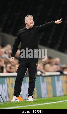 Manager Neil Harris (Manager Cambridge United) makes notes during the ...