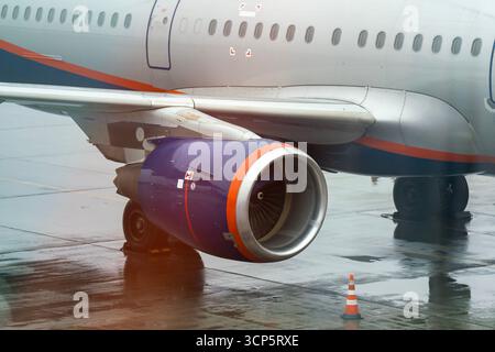 A jet engine pod under the wing of a passenger airplane Stock Photo - Alamy