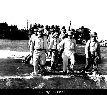 General Douglas MacArthur wades ashore during initial landings at Leyte ...