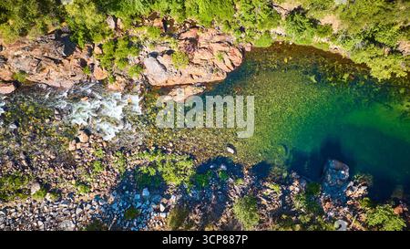 An aerial view of a green forest at the shore Stock Photo - Alamy