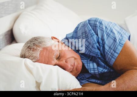 Gray pillow on blue bed decoration in bedroom interior Stock Photo - Alamy