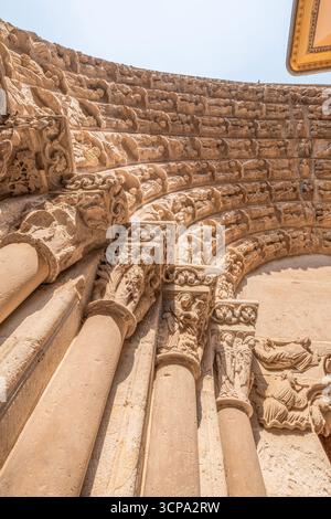 The ornate carved Romanesque capitals of columns of the Southern portal ...