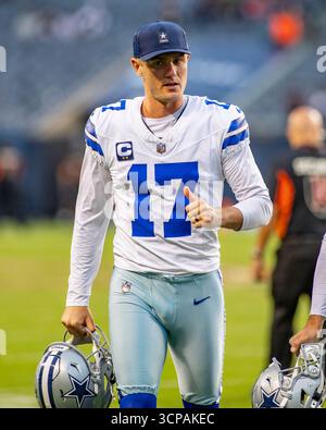 Dallas Cowboys' Brandon Aubrey (17) kicks an extra point as Bryan Anger ...