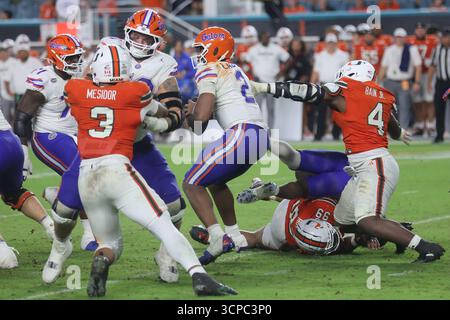 Miami defensive lineman Rueben Bain Jr. (4) pressures Florida State ...