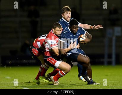 Sale Sharks' Nathan Jibulu is tackled by Exeter Chiefs' Bachuki ...