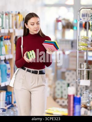 cleaning woman detergent rags sponges protective gloves Stock Photo - Alamy