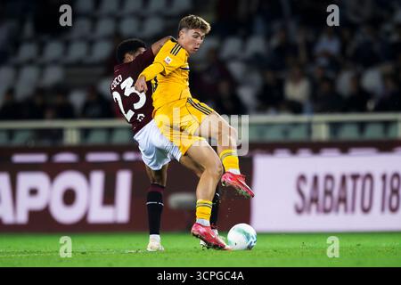 Louis Buffon of Pisa SC competes for the ball with Jhon Lucumi of ...