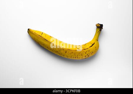 illustration of bright blue banana on pastel yellow background in ...