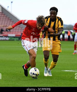 Barnsley's Caylan Vickers battles for the ball against Port Vale's ...