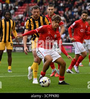 Barnsley's Caylan Vickers dribbles with the ball in the match between ...