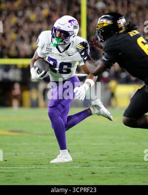 TCU running back Jeremy Payne, center, runs off the field after scoring ...
