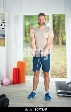 Handsome millennial Latin male at the train station hailing a ride ...