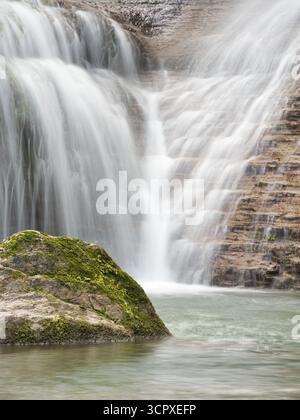 A silk effect water flowing down a rocky cliff Stock Photo - Alamy