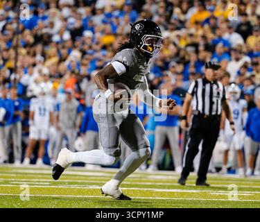Colorado quarterback Kaidon Salter (3) runs out of the tackle attempt ...