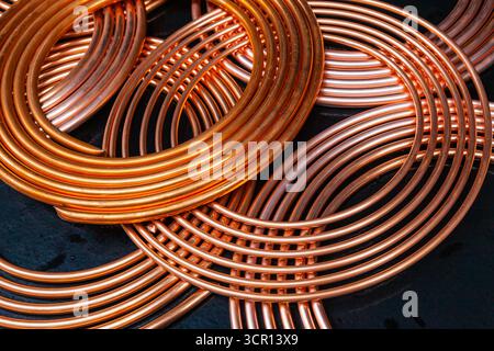 New copper twisted pipes of the same diameter Stock Photo - Alamy