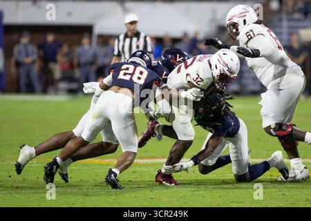 Florida State running back Ousmane Kromah (32) is tackled by Florida ...