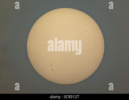 Sunspots are visible as the sun shines through light clouds over Beirut ...