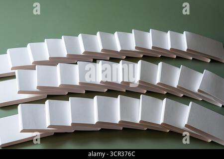 Pile of blank white rectangular objects on black surface Stock Photo ...