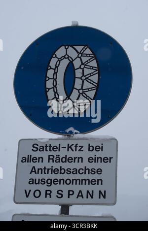 snow chain obligation traffic sign, on a snowy winter road Stock Photo ...