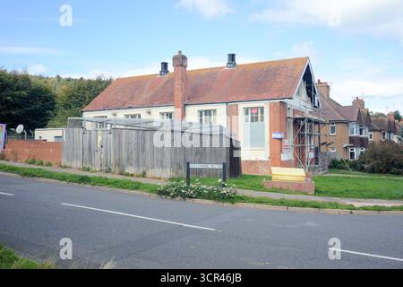 Side view of The Salvation Army building with red shield logo and ...