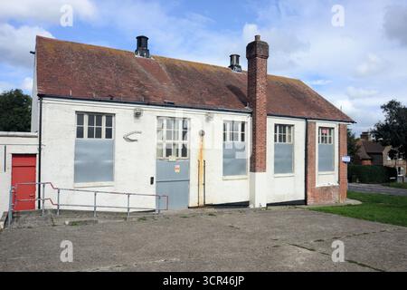 Side view of The Salvation Army building with red shield logo and ...