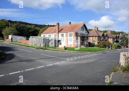 Side view of The Salvation Army building with red shield logo and ...