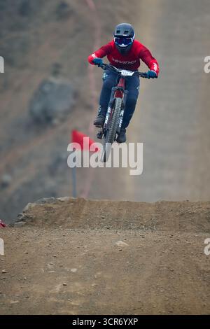 Speed, gravity, and pure adrenaline — a downhill rider carving through ...
