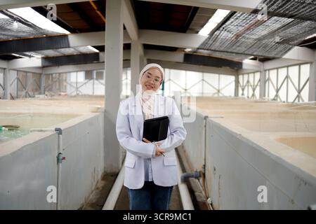 Veterinarian Inspecting Fish Health in Modern Aquaculture Hatchery ...