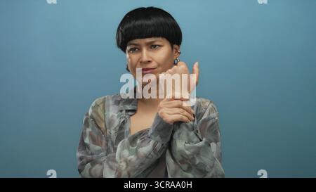 Asian woman experiencing wrist pain in office for work health issues ...