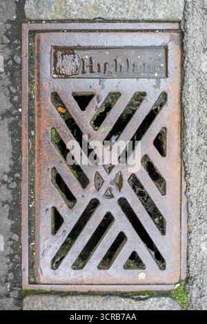 The sewer grate on the sidewalk is rusty close up Stock Photo - Alamy