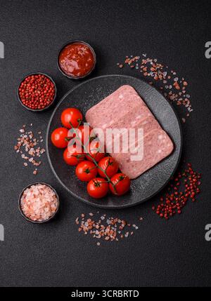 Spiced ham slices, canned meat for lunch sandwiches. Spiced ham as a ...