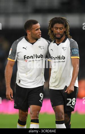 Derby County's Dion Sanderson (right) celebrates scoring their side's ...