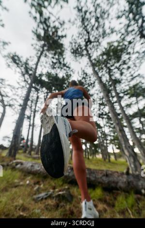 Adventurous Woman Overcoming Forest Obstacles with Determination and ...