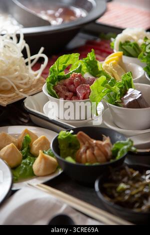 A view of all the elements of a hot pot meal Stock Photo - Alamy
