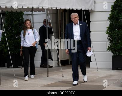 President Donald Trump walks out of Walter Reed National Military ...