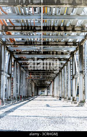 Modern overhead pedestrian tunnel metal air bridge exterior in city ...