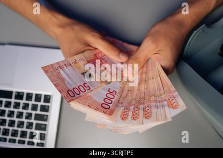 top view of man counting russian money near table Stock Photo - Alamy