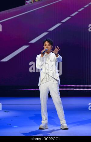 Hong Kong singer Stephen Lee Hacken singing on the stage at China’s ...