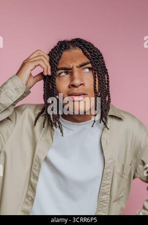Portrait thoughtful confused young african american businesswoman ...