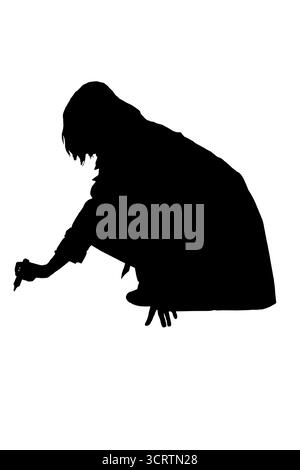 side view of a woman squatting who is drawing with a marker on the ...